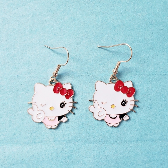 Hello Kitty | Jewelry | 35 Flying Hello Kitty With Peace Sign Earrings ...